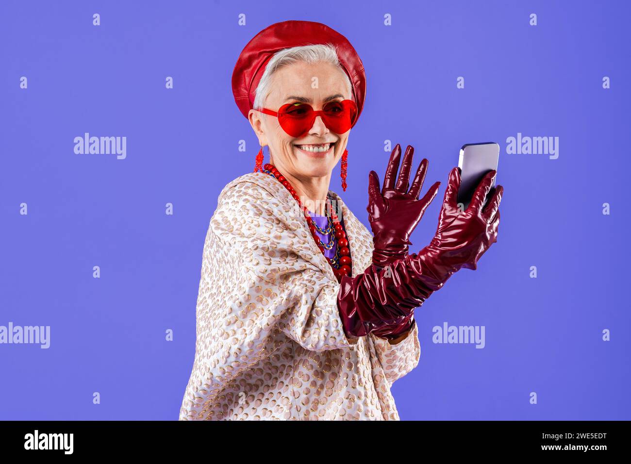 Happy and funny senior old woman wearing fashinable clothing on ...