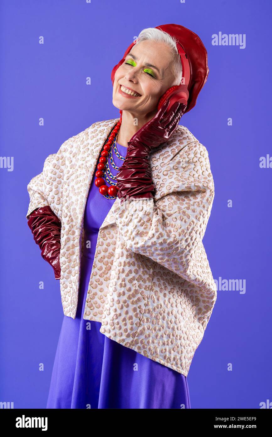 Happy and funny senior old woman wearing fashinable clothing on ...