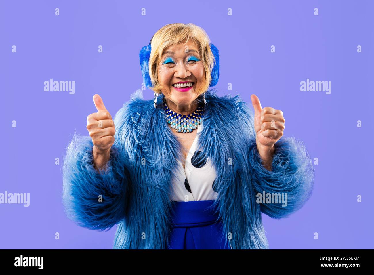 Happy and funny senior old woman wearing fashinable clothing on ...