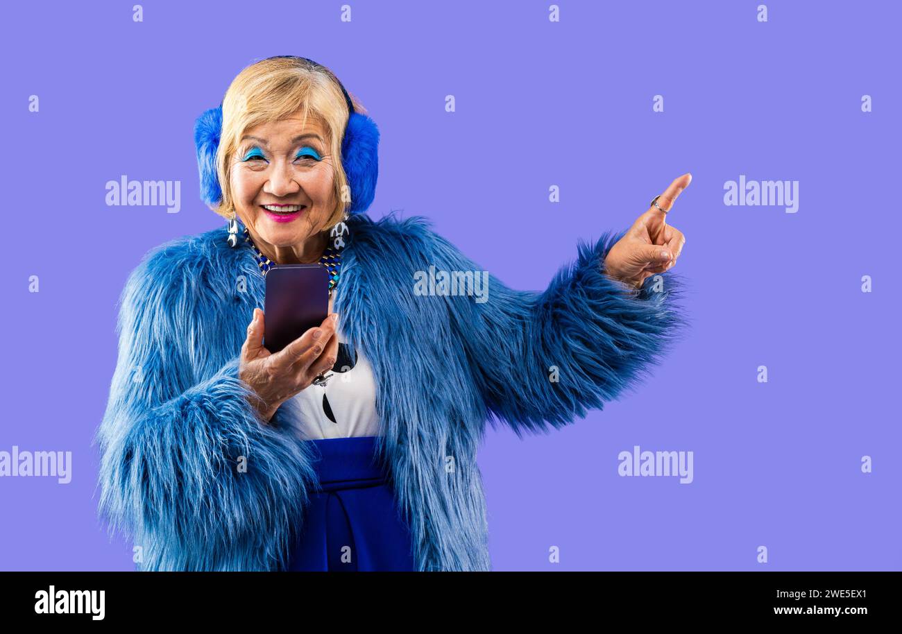 Happy and funny senior old woman wearing fashinable clothing on ...