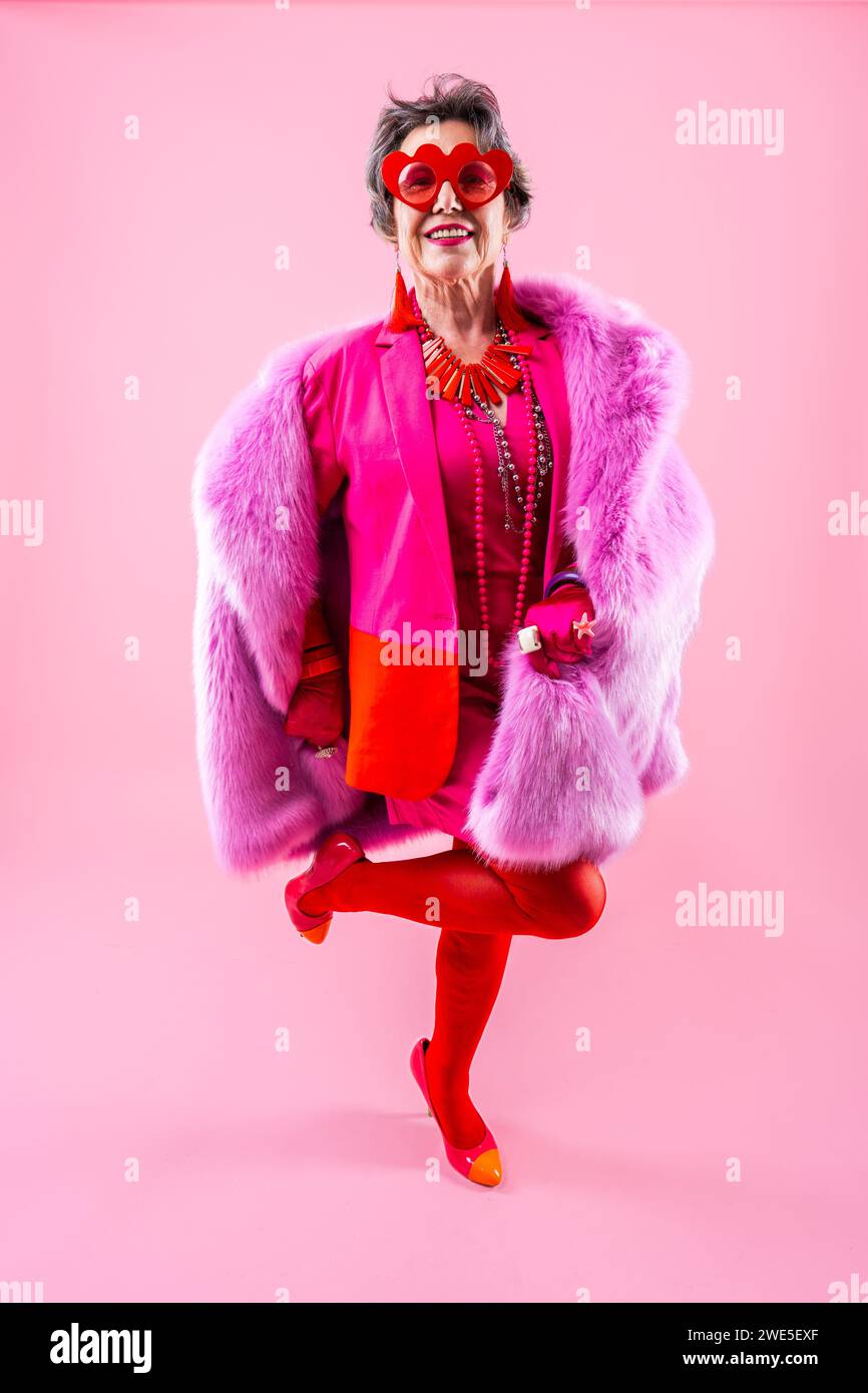 Happy and funny senior old woman wearing fashinable clothing on ...