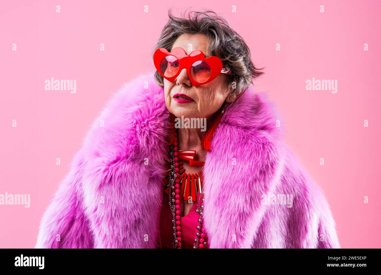 Happy and funny senior old woman wearing fashinable clothing on ...