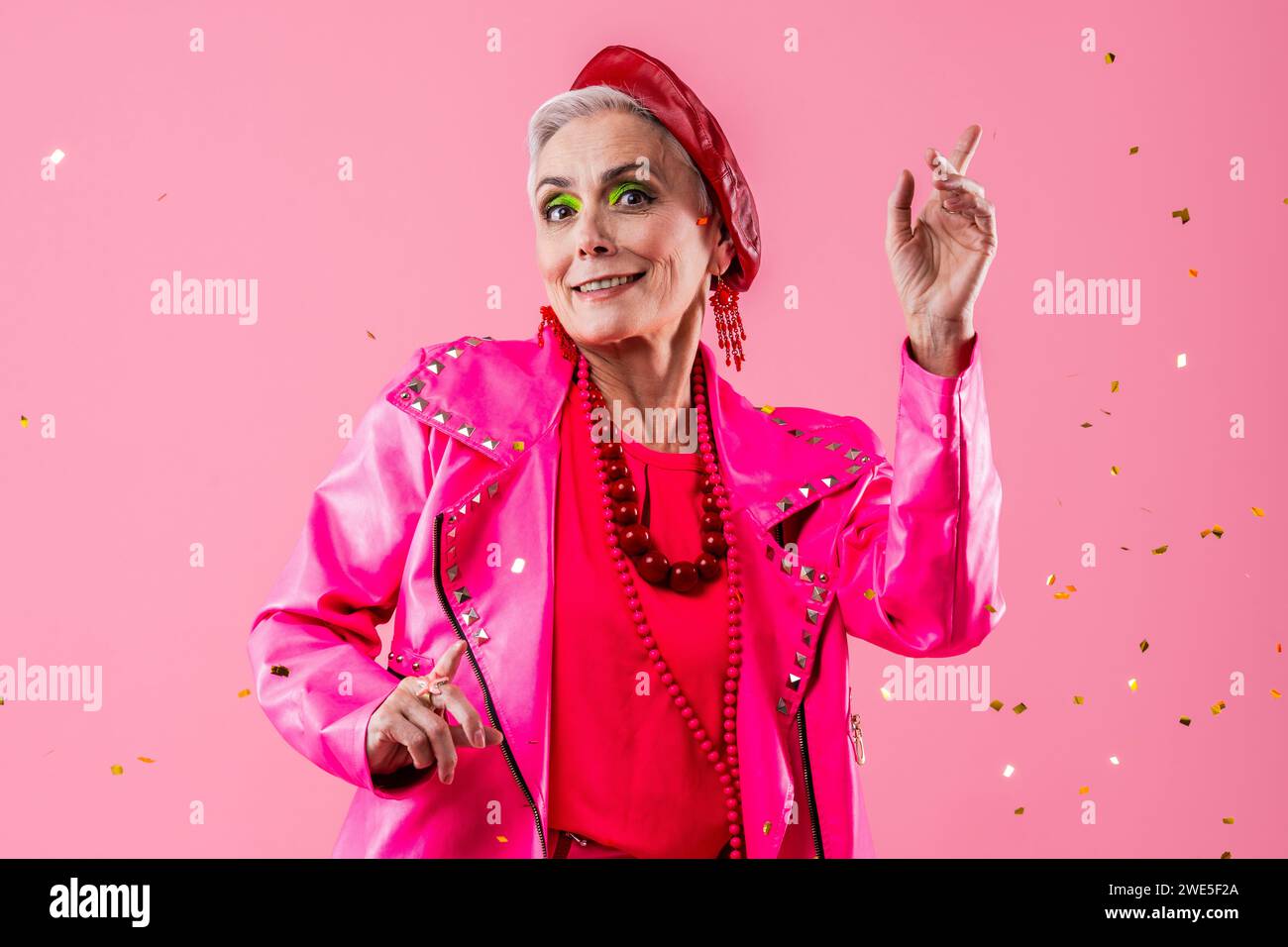 Happy and funny senior old woman wearing fashinable clothing on ...