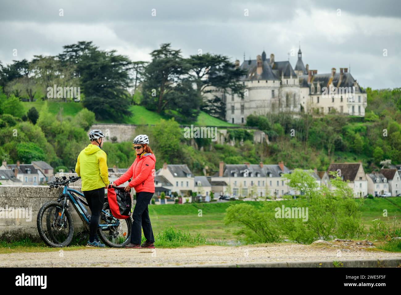 Man and woman cycling taking a break, Château de Chaumont in the ...