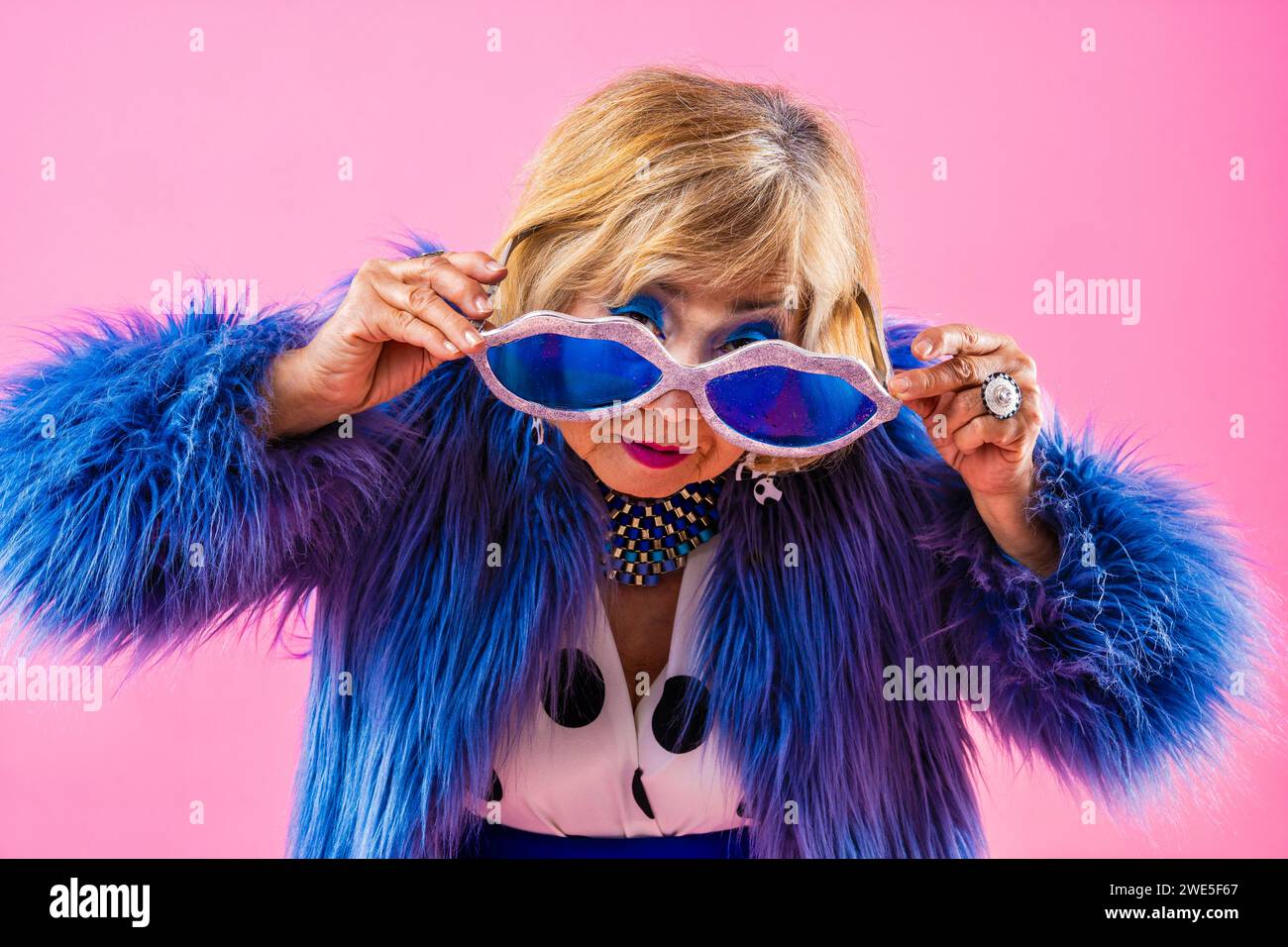 Happy and funny senior old woman wearing fashinable clothing on ...