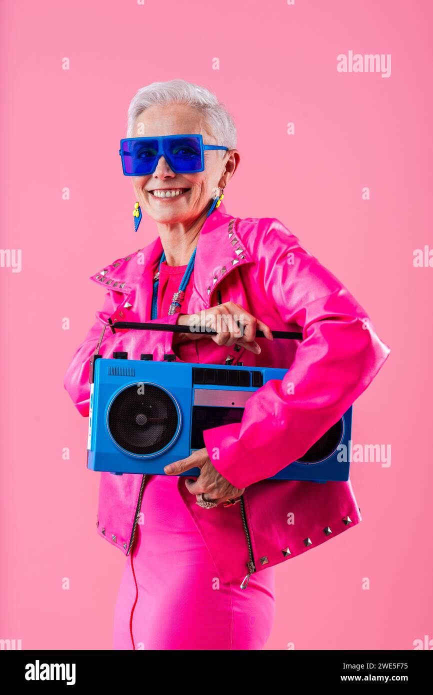 Happy and funny senior old woman wearing fashinable clothing on ...