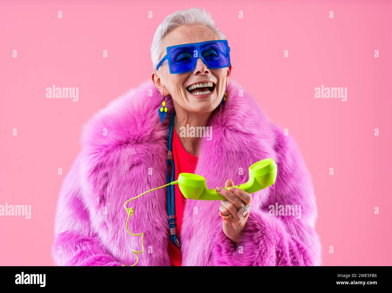 Happy and funny senior old woman wearing fashinable clothing on ...