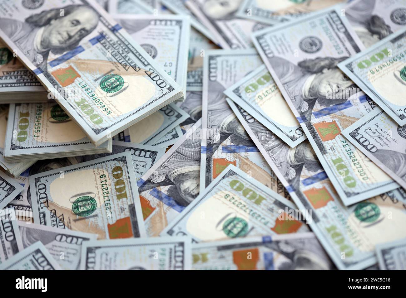 Very big amount of US hundred dollar bills close up. Huge quantity of ...