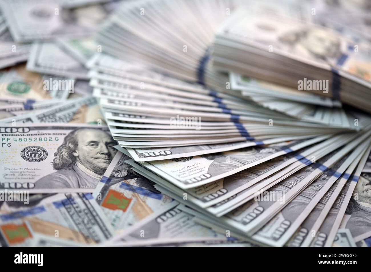 Very big amount of US hundred dollar bills close up. Huge quantity of ...