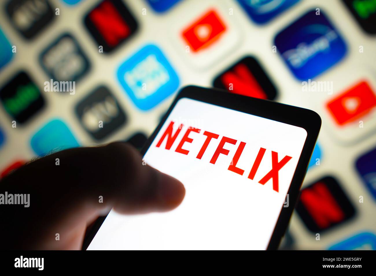 In this photo illustration, the Netflix logo is displayed on a ...