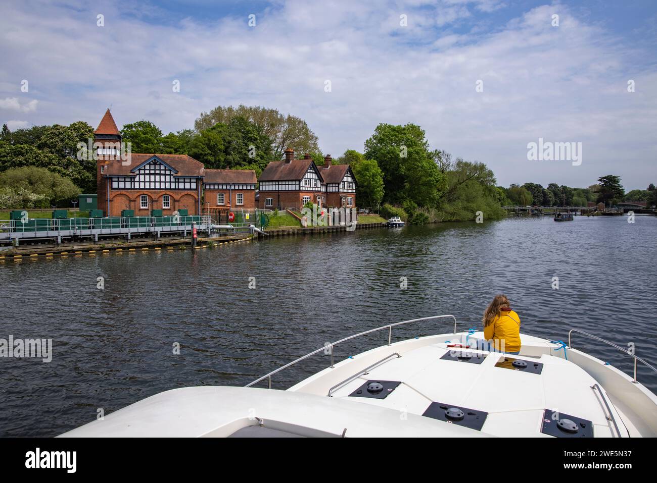 Woman on bow of Le Boat Horizon 4 houseboat on River Thames, Runnymede ...