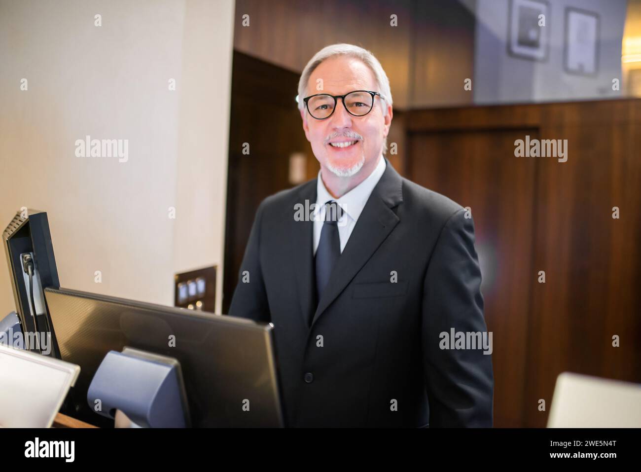 Receptionist man hi-res stock photography and images - Alamy