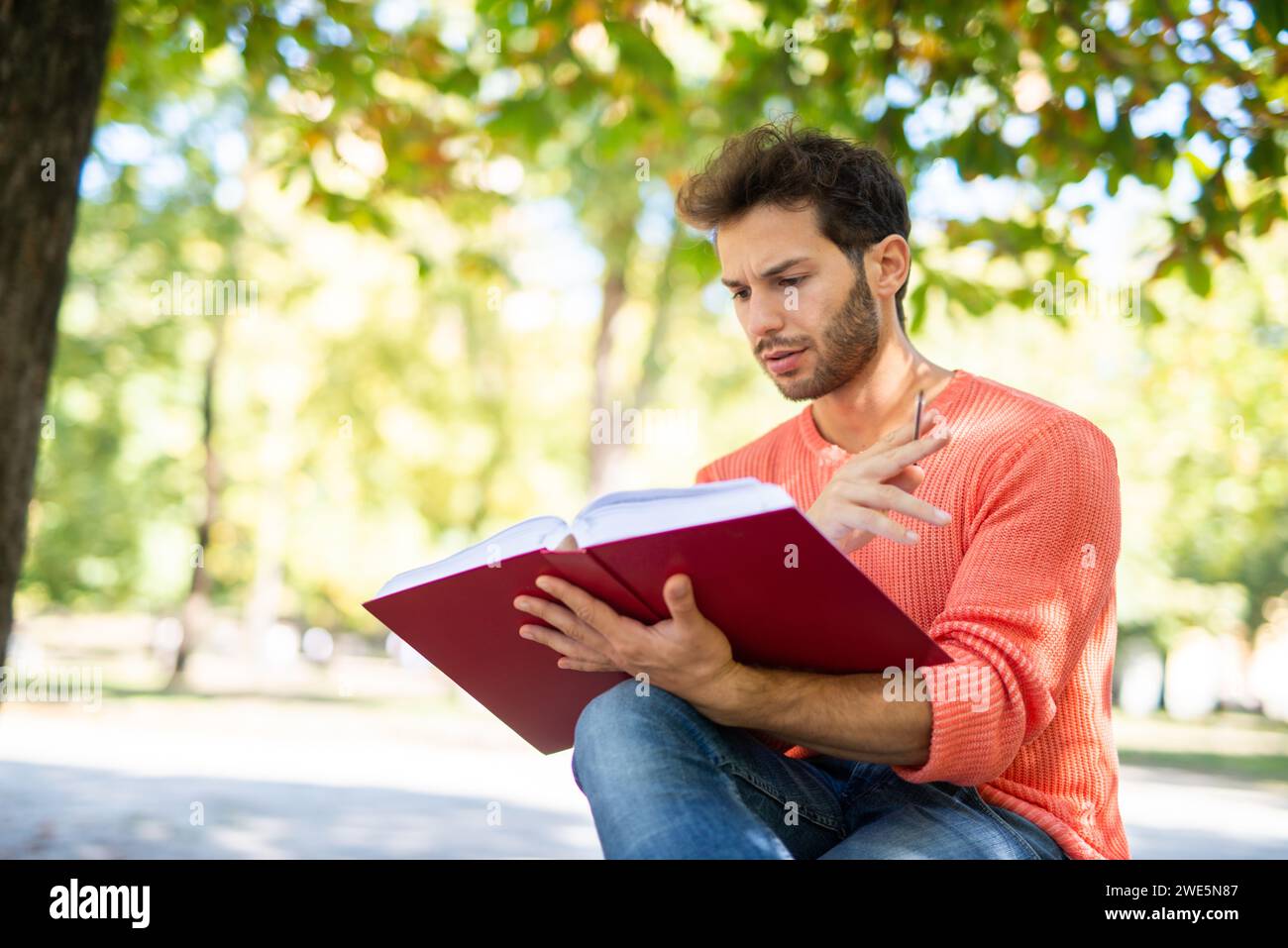 Male student reading hi-res stock photography and images - Alamy