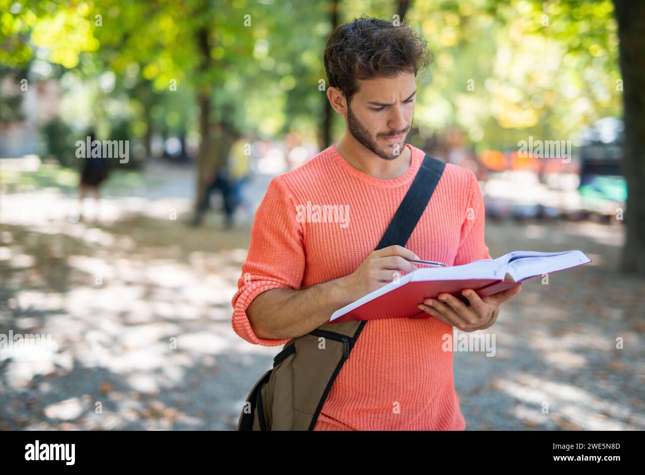 Reading a book walking hi-res stock photography and images - Alamy