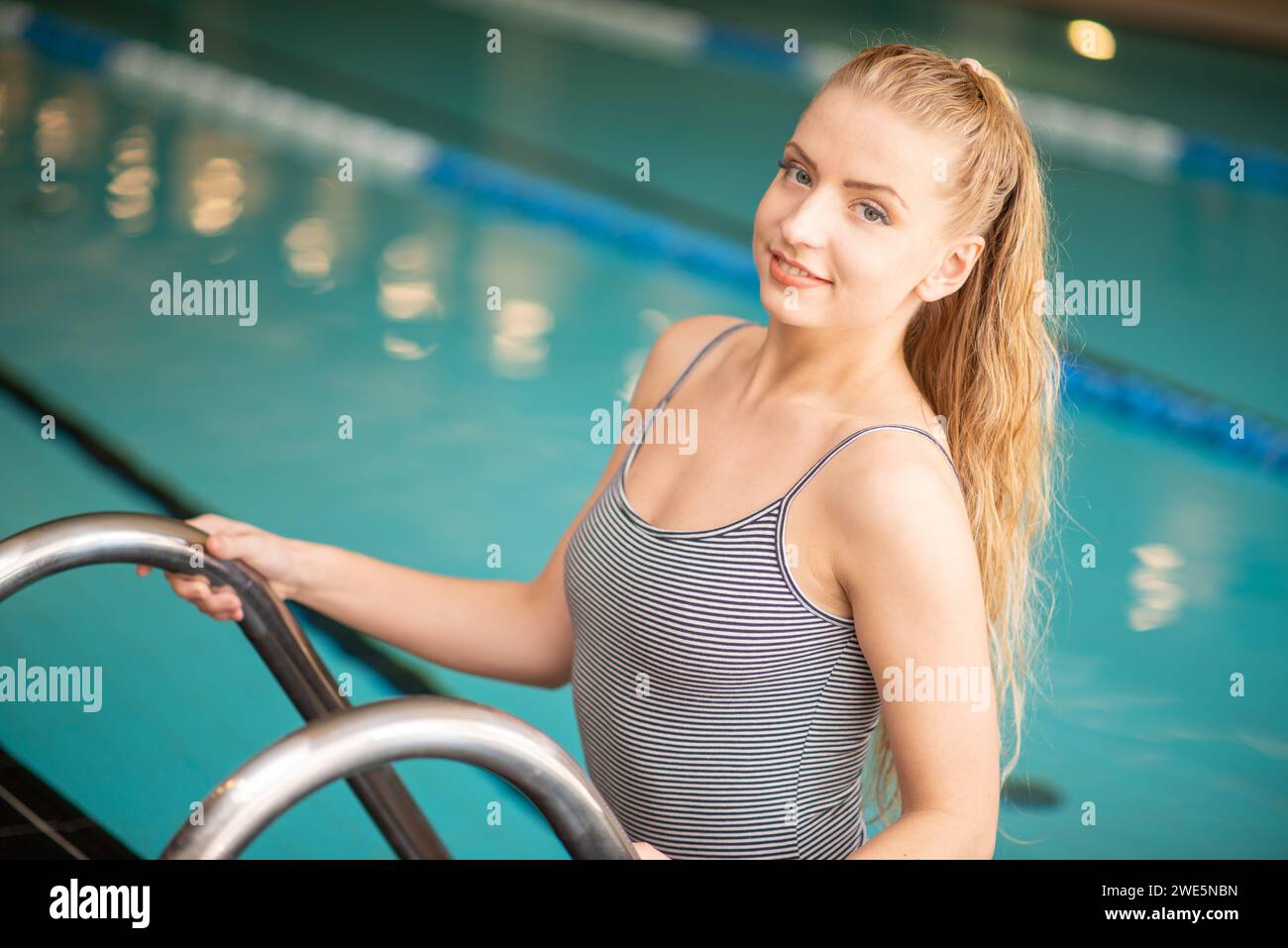 Blonde woman indoor swimming pool hi-res stock photography and images ...