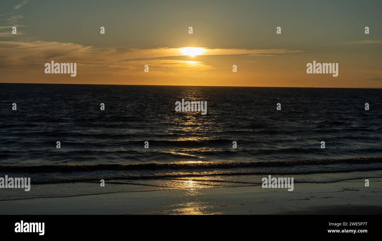 Clear sunset at the beach Stock Photo - Alamy