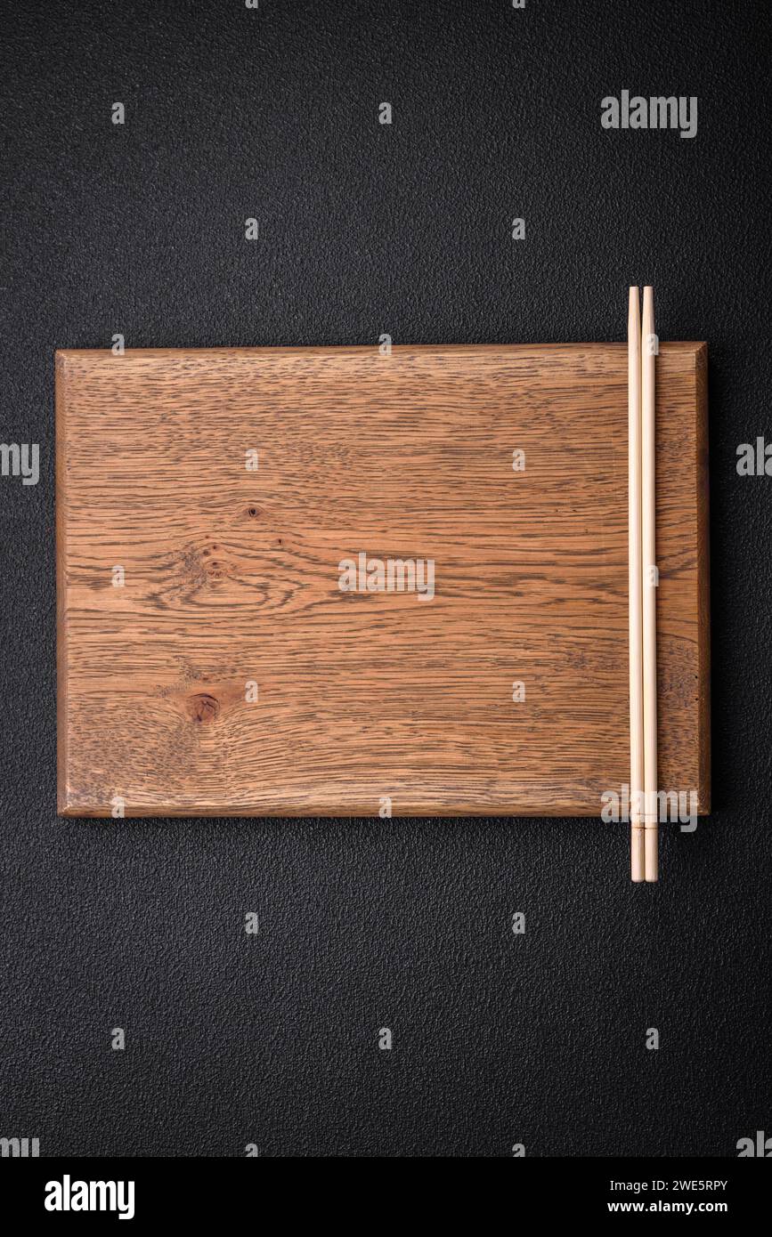 Light wooden chopsticks on a blank background as a backdrop for an ...