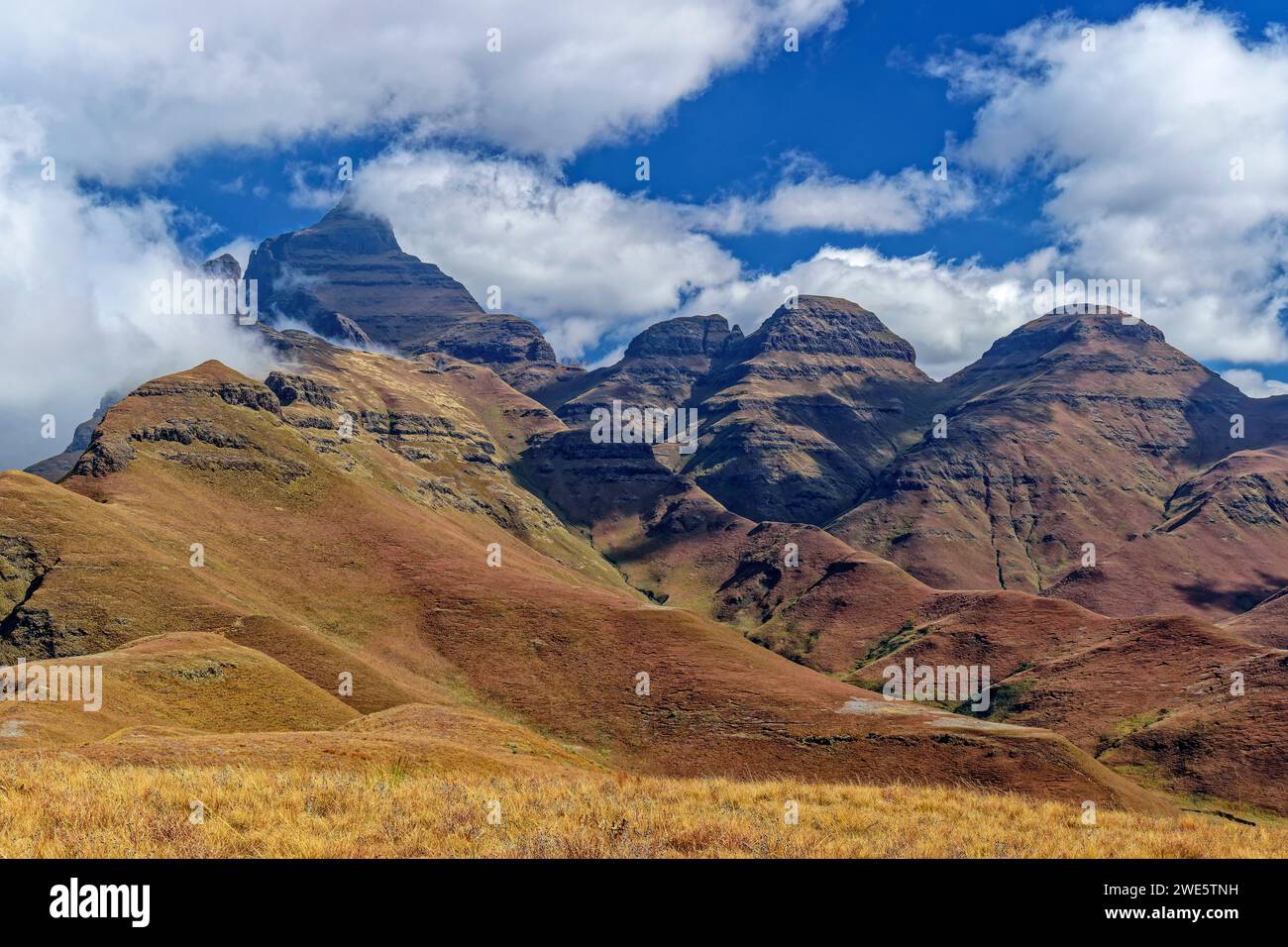 Cloudy atmosphere over the Drakensberg with Cathedral Peak, Baboon Rock ...