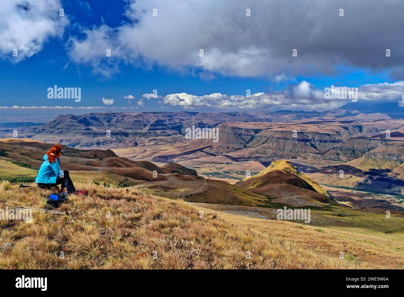Woman hiking looks at Little Berg, Baboon Rock, Didima, Cathedral Peak ...