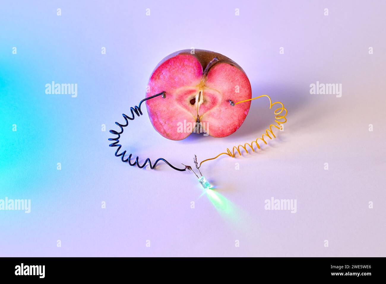 Free energy electricity generator using apple close up Stock Photo - Alamy