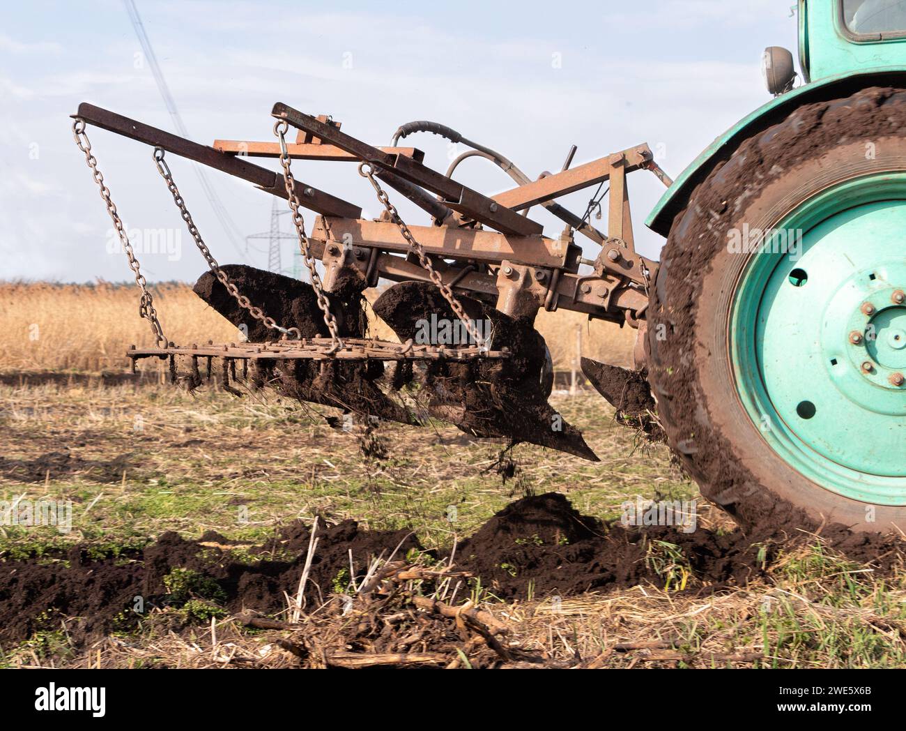 Side view of tractor with plough hi-res stock photography and images ...