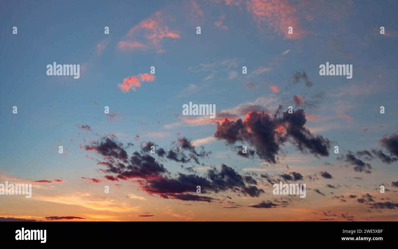 Beautiful dramatic sky with clouds at sunset. Evening sky with pink ...