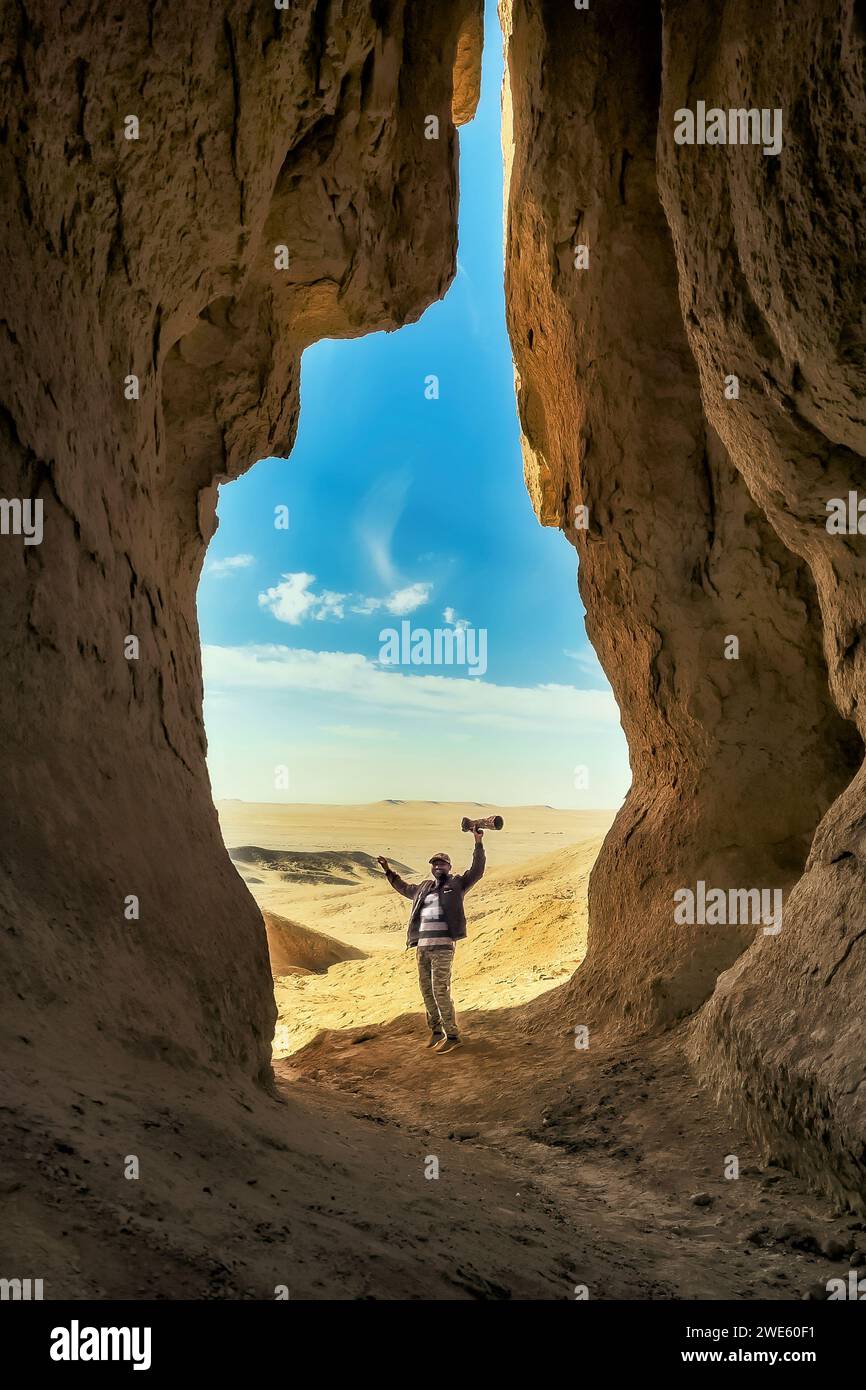 The photographer at desert cave near Riyadh, Saudi Arabia Stock Photo ...
