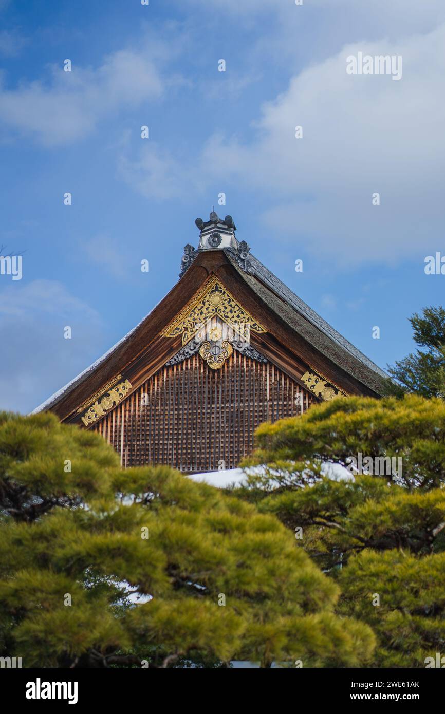 A pagoda with lush trees and a bird soaring above Stock Photo - Alamy