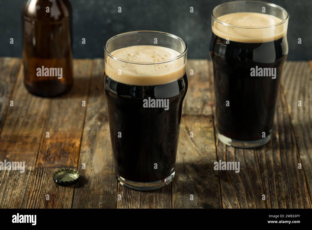 Boozy Dark Irish Stout Beer in a Pint Glass Stock Photo - Alamy