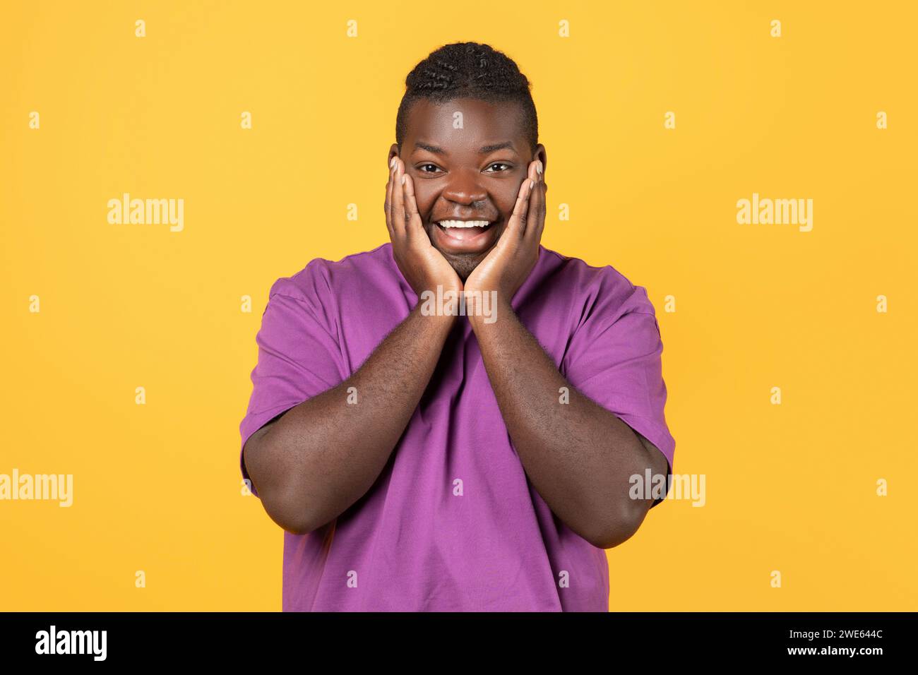 Excited Black Man Cupping Face In Hands On Yellow Background Stock ...