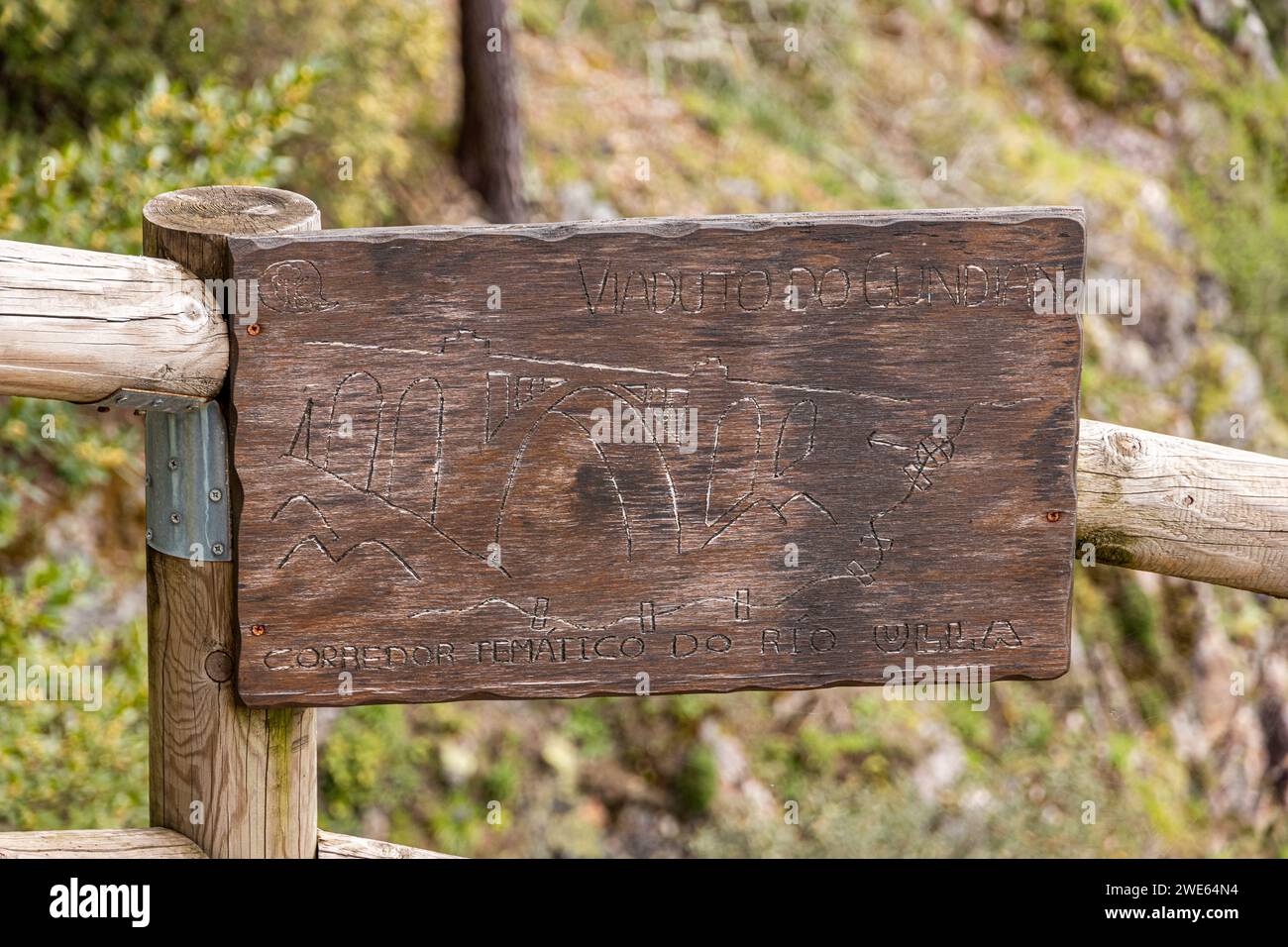 A Ponte Ulla, Spain. Wooden carved plaque of the viaduct of Gundian, a ...