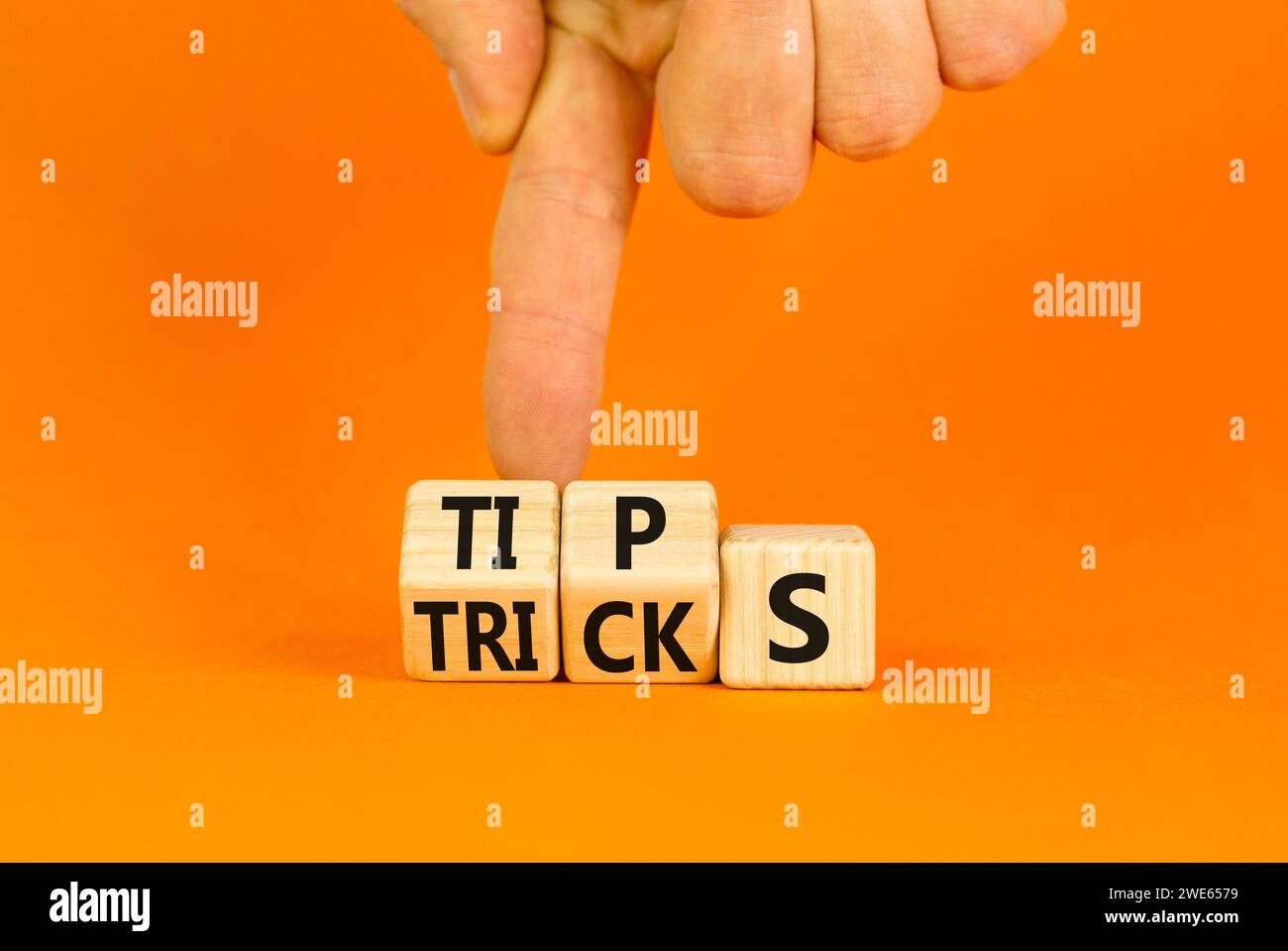 Tips and tricks symbol. Turned wooden cubes and changed the word tricks ... Tips and tricks symbol. Turned wooden cubes and changed the word tricks ...