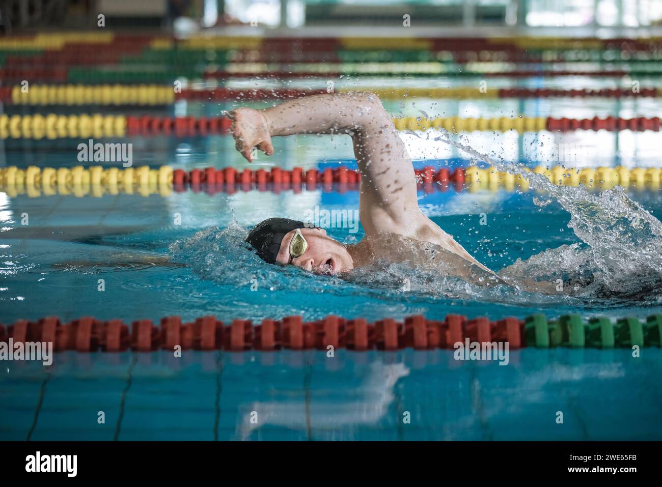 Professional male swimmer swimming the front crawl style. Freestyle ...