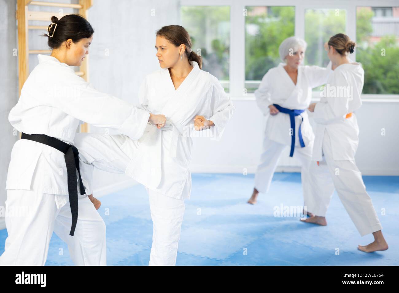 Strong fighter practicing kicks in hi-res stock photography and images ...