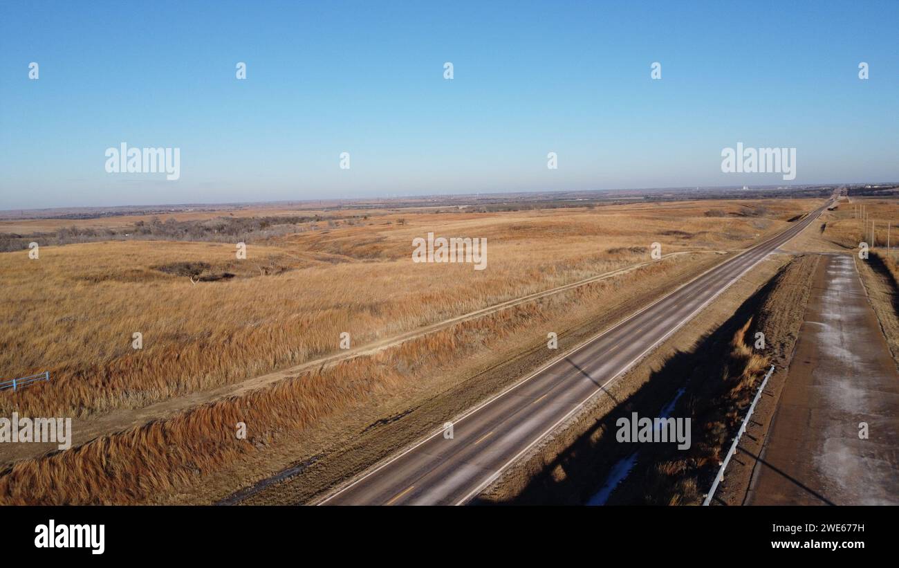 A scenic view of a lengthy railway track meandering through arid ...