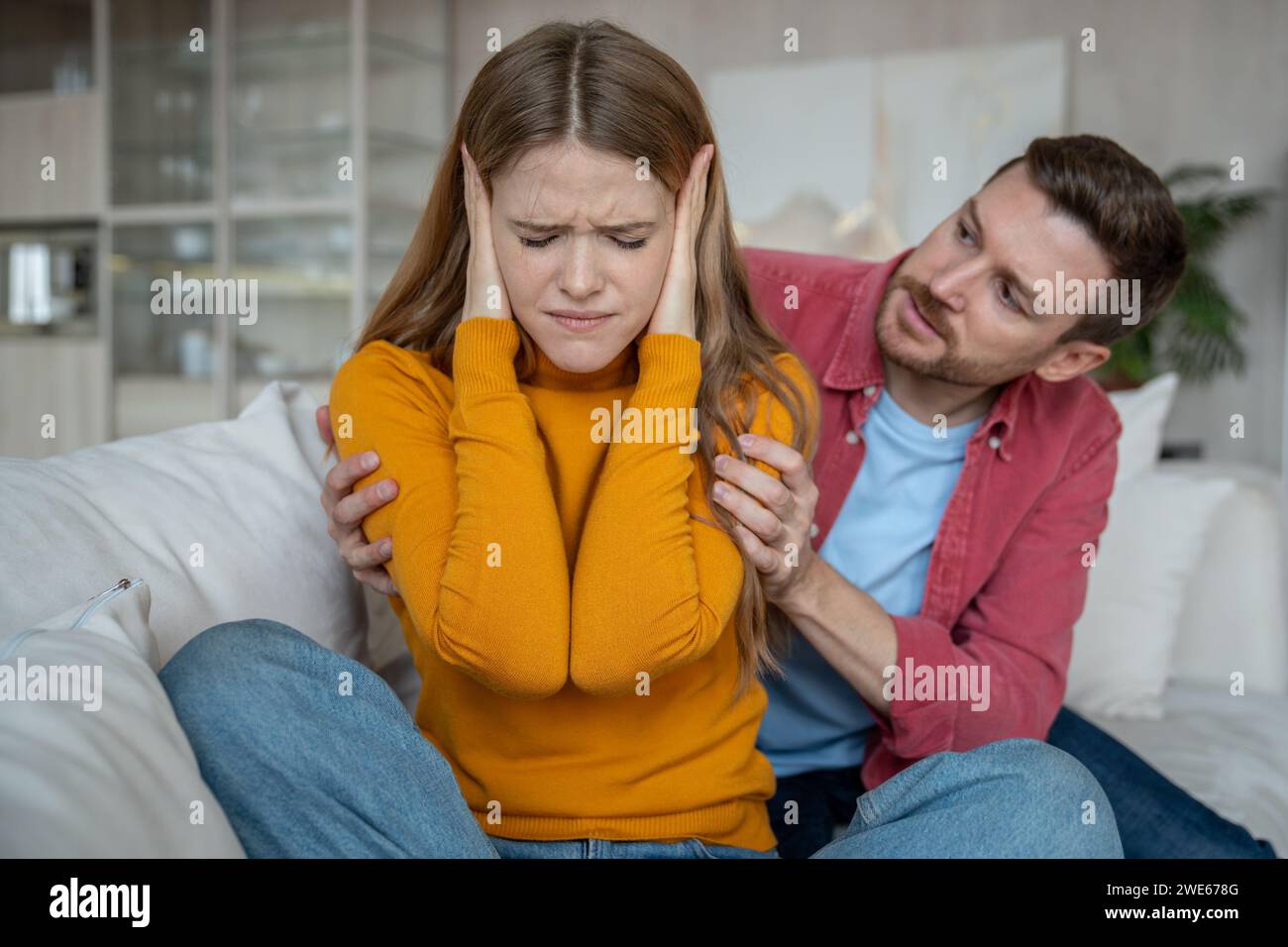 Annoyed offended unhappy wife closing ears with hands, doesnt want to ...