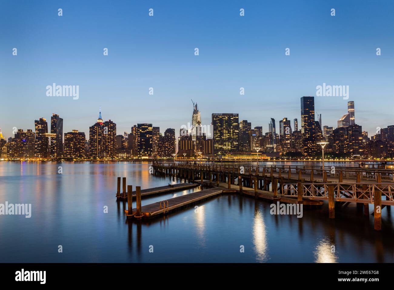 A midtown Manhattan and East River view from Long Island city at dusk ...