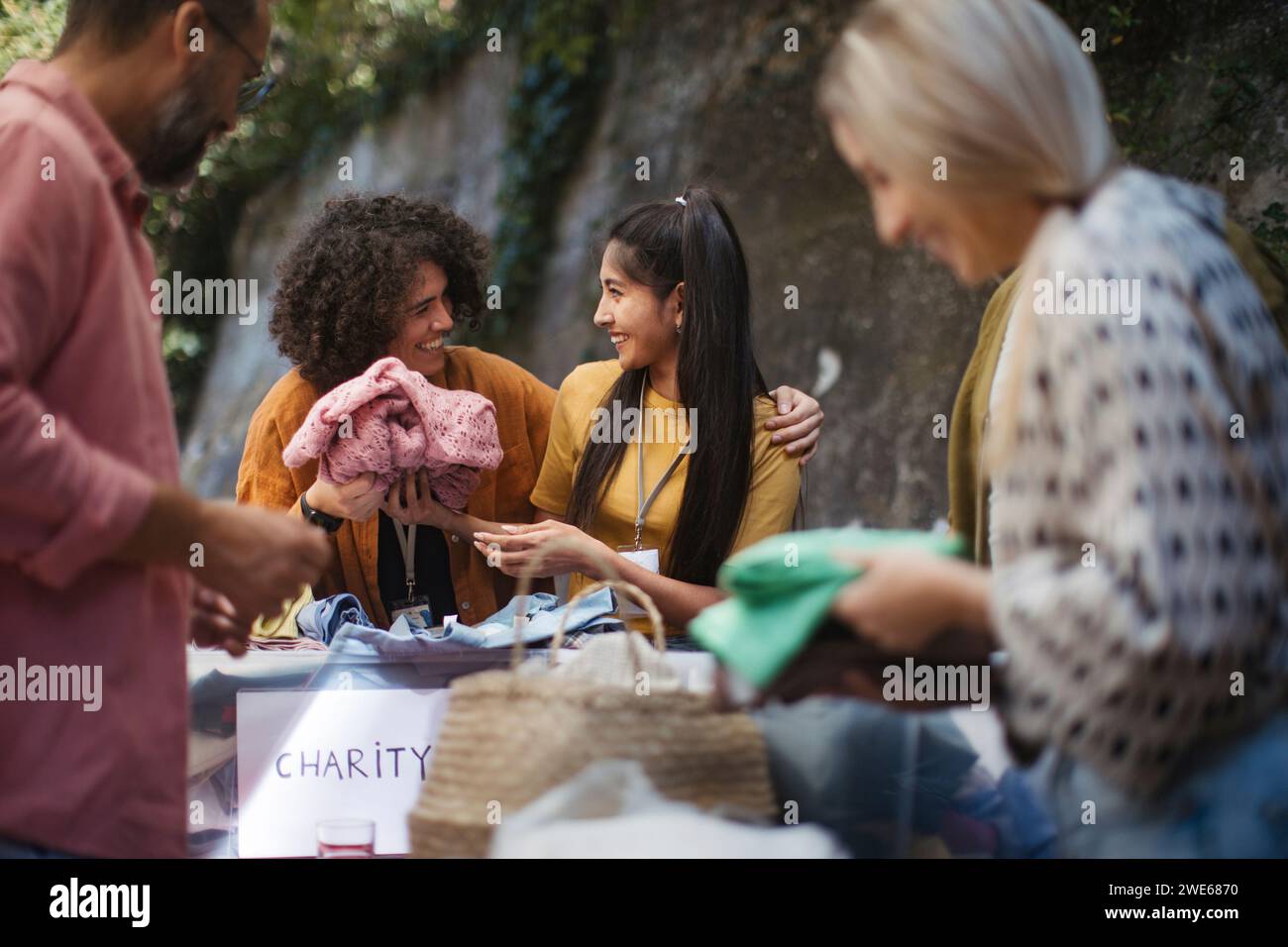 People donating and collecting clothes for charity Stock Photo - Alamy