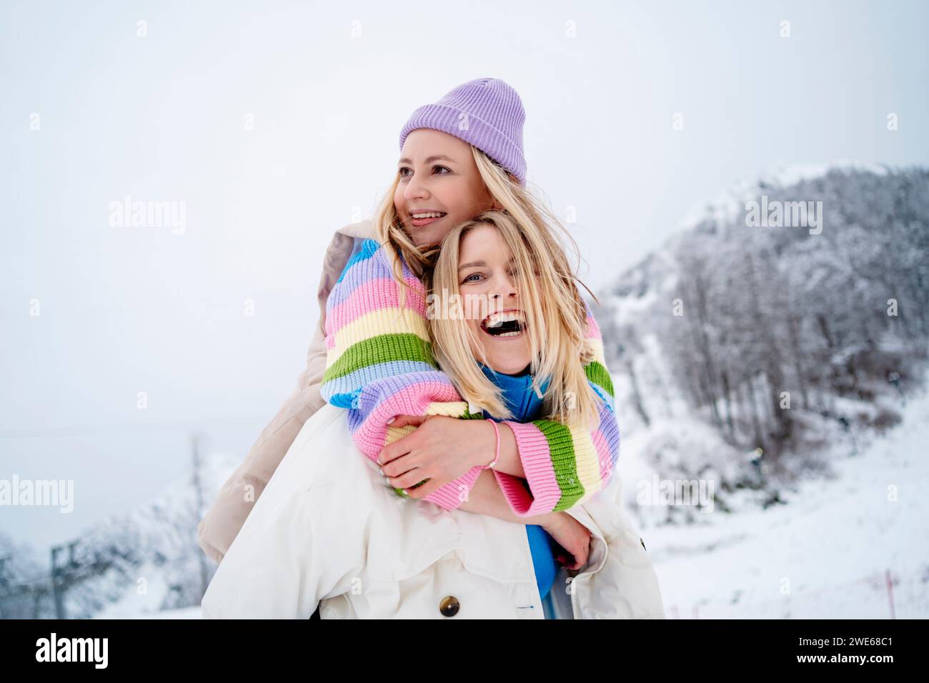 Two women giving piggyback on hi-res stock photography and images - Alamy