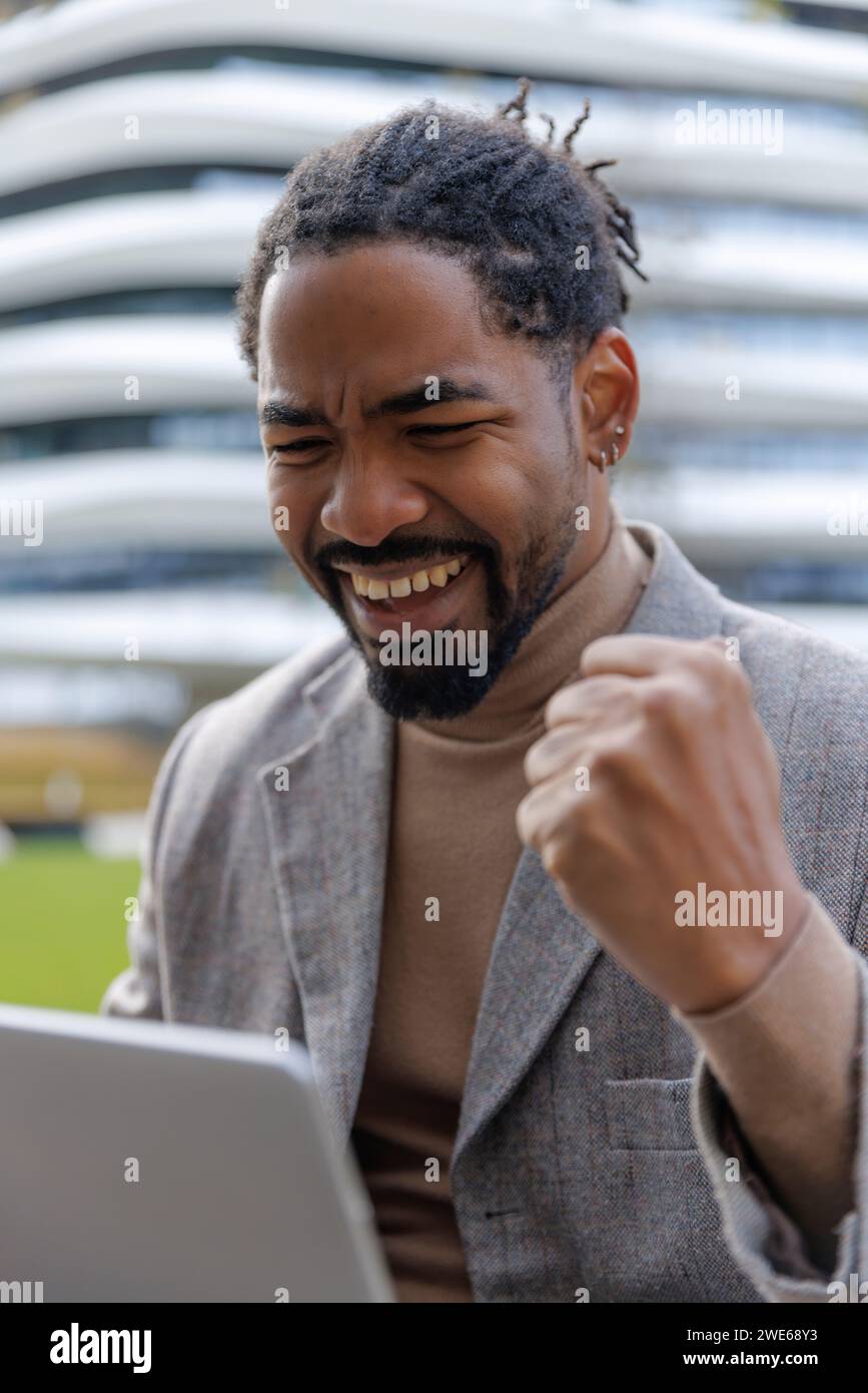 Happy man celebrating success achievement hi-res stock photography and ...