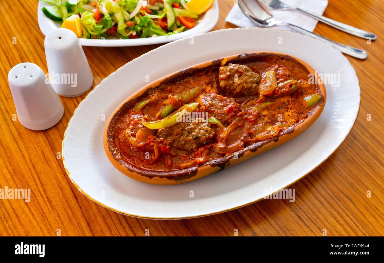 Izmir kofte, turkish dish of spicy meatballs Stock Photo - Alamy