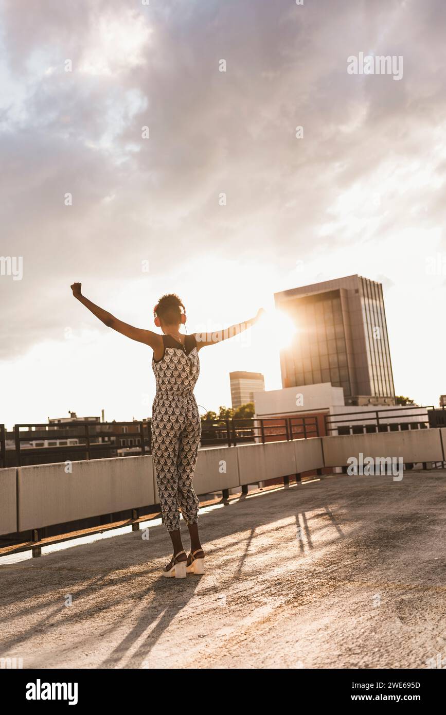 Carefree woman headphones dancing hi-res stock photography and images - Alamy