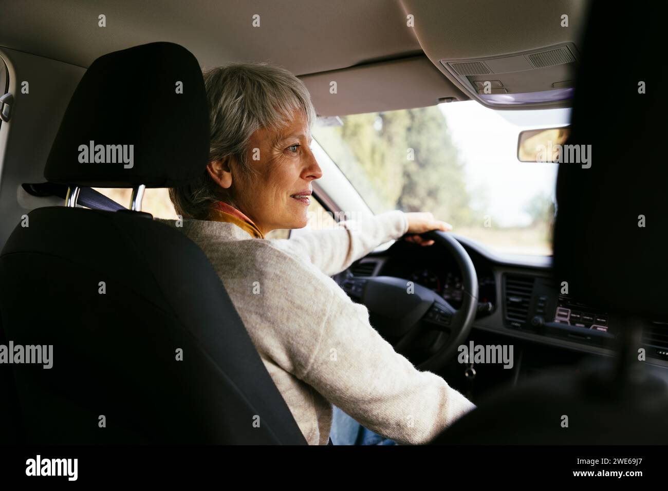 Mature woman driving car interior hi-res stock photography and images ...