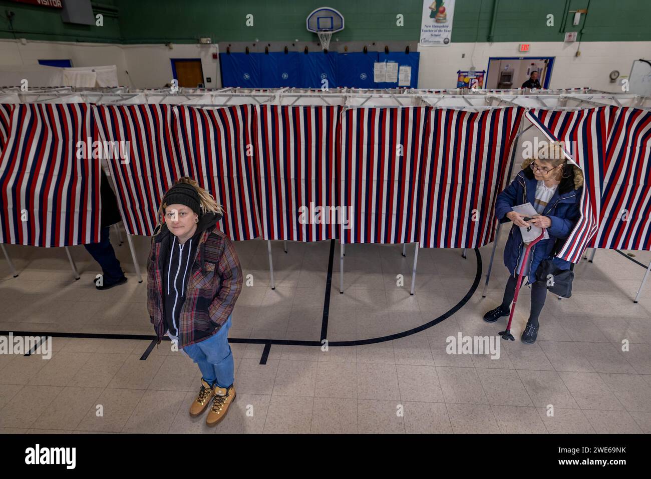 MANCHESTER, NEW HAMPSHIRE - JANUARY 23: Voters head into the polling ...