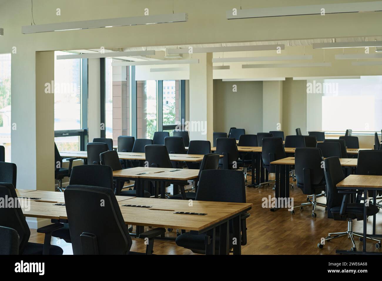 Empty office with desks and chairs Stock Photo - Alamy