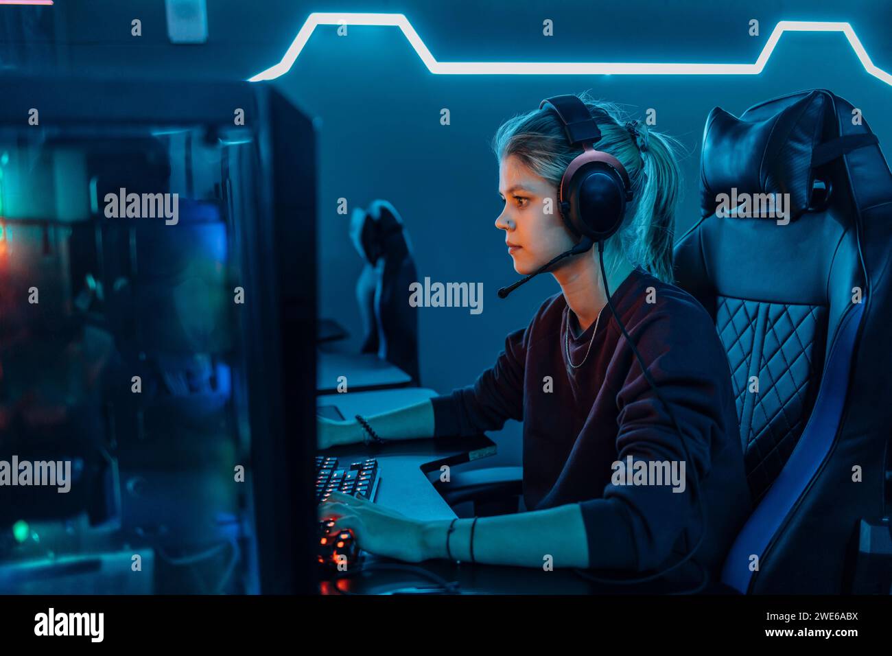 Gamer with headset playing games on computer Stock Photo - Alamy