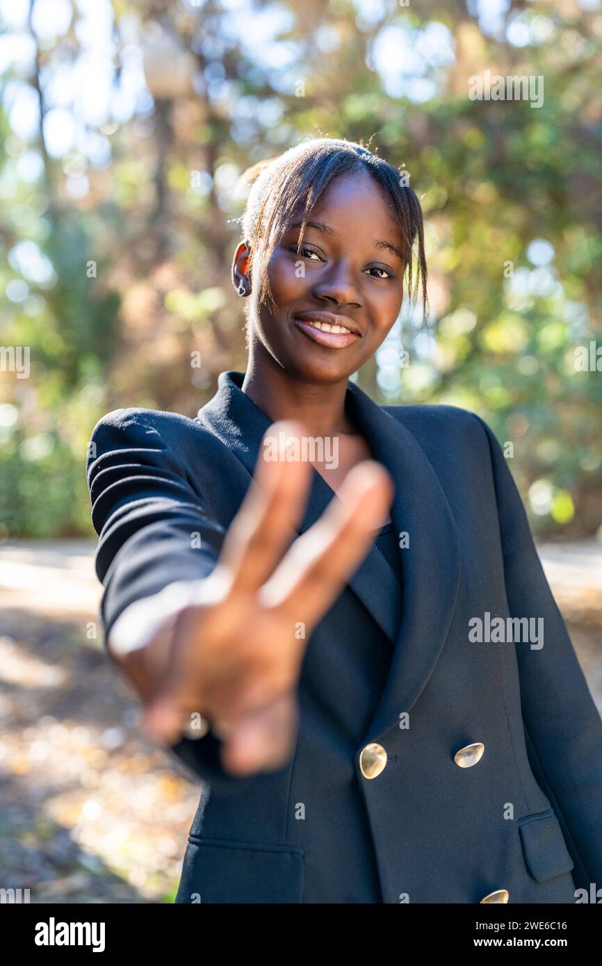 Gesturing peace sign hi-res stock photography and images - Alamy