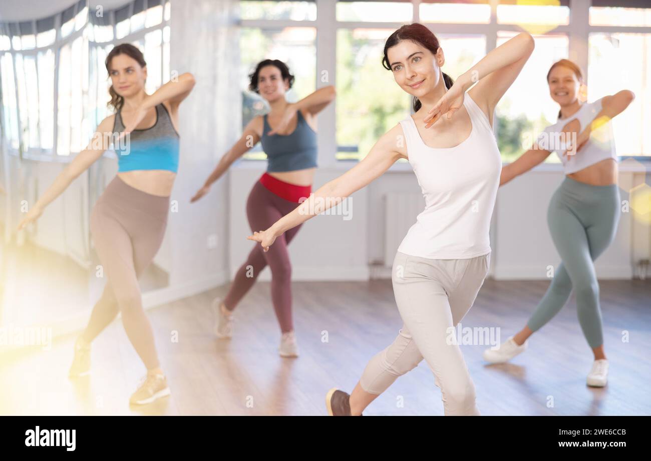 Group of women dancing modern dance in studio Stock Photo - Alamy