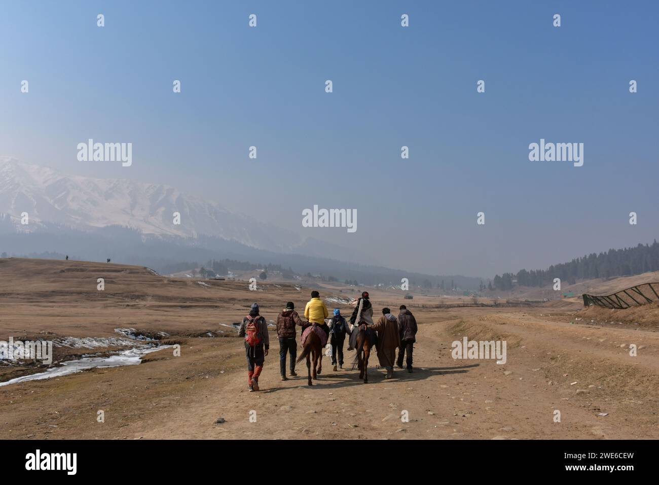 Gulmarg, India. 23rd Jan, 2024. Indian tourists enjoy horse ride at the ...