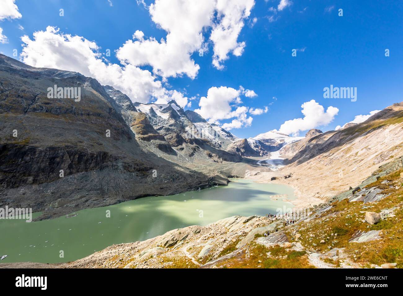 Sandersee lake near mountains under cloudy sky at Grossglockner ...